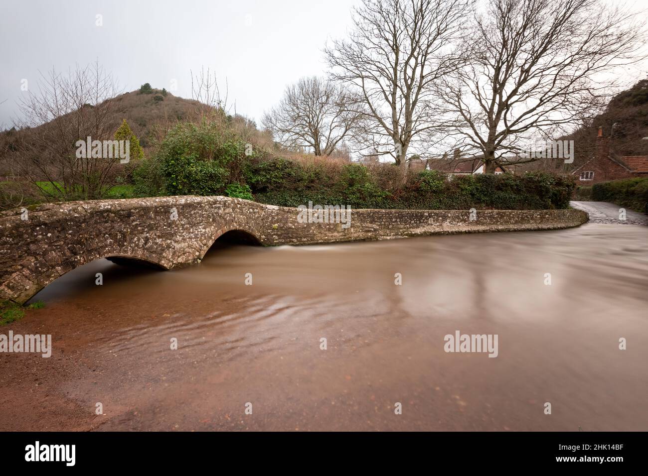 Long exposure of the river Avill flowing under Gallox bridge in Dunster ...