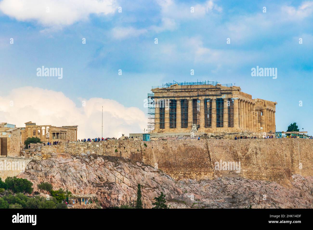 Acropolis of Athens on hill with amazing and beautiful ruins Parthenon and blue cloudy sky in ...