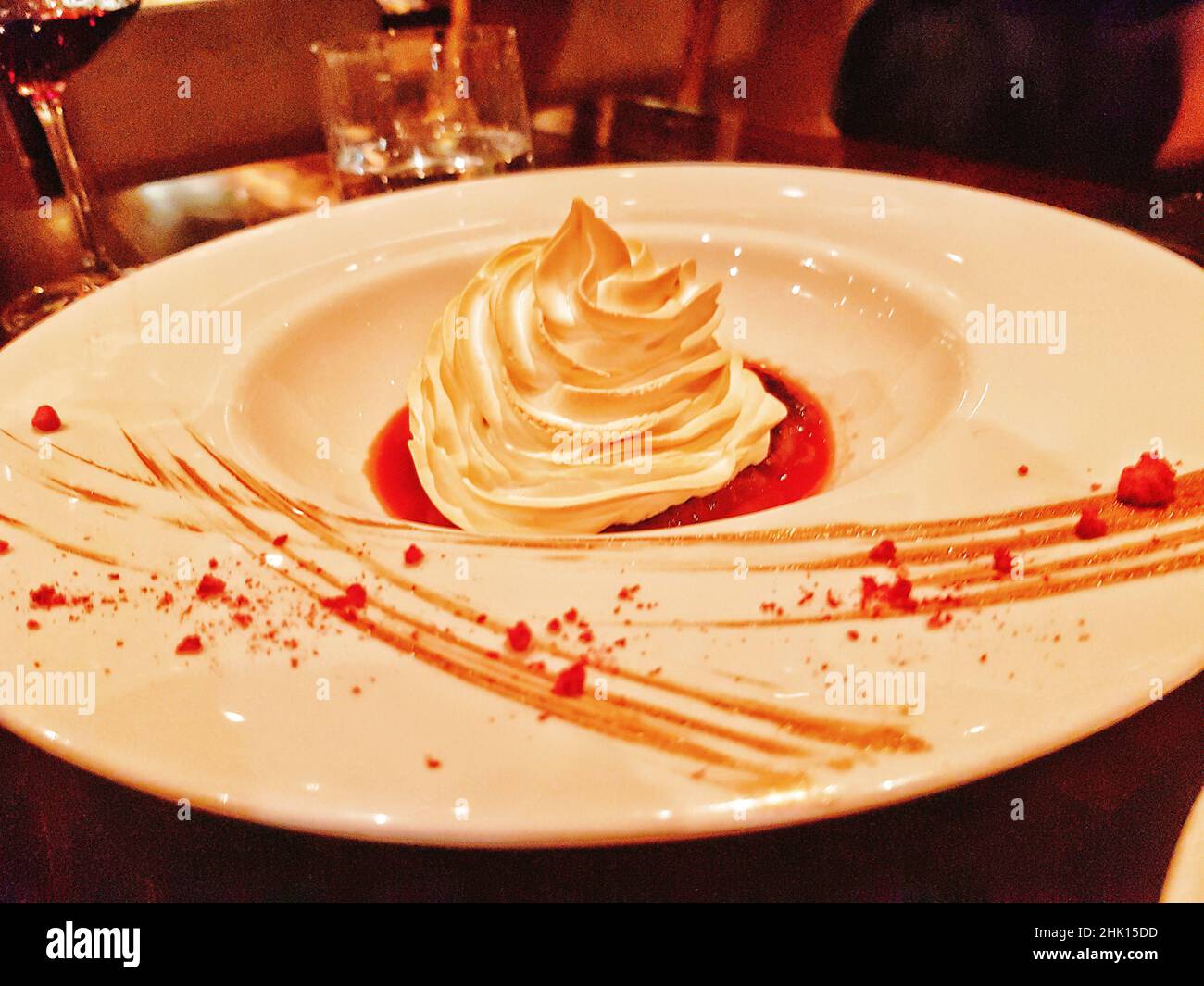 Pavlova dessert at restaurant table Stock Photo - Alamy