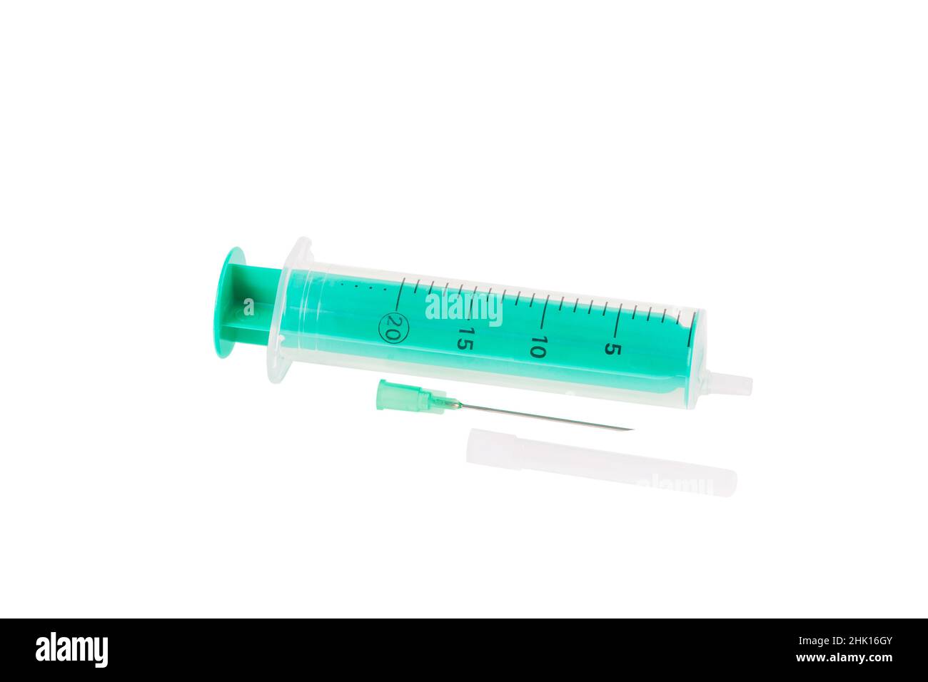 Green plastic syringe. Isolated on a white background Stock Photo - Alamy