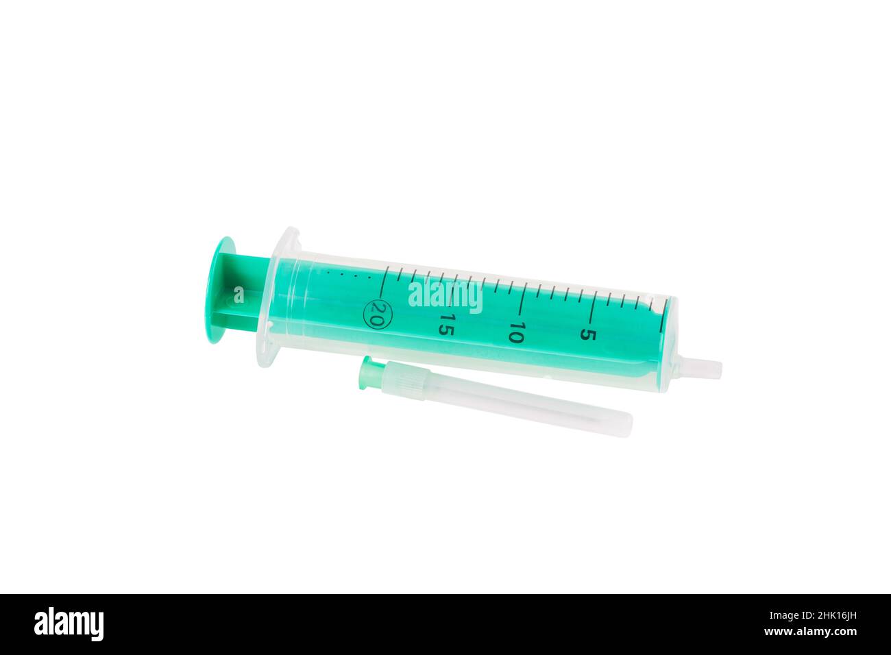 Green plastic syringe. Isolated on a white background Stock Photo - Alamy