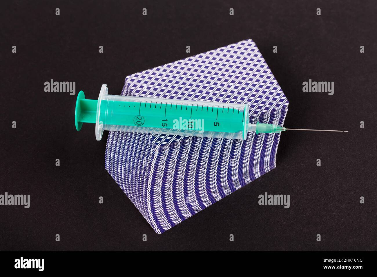 Syringe and playing cards as a vice. Located on a black background ...