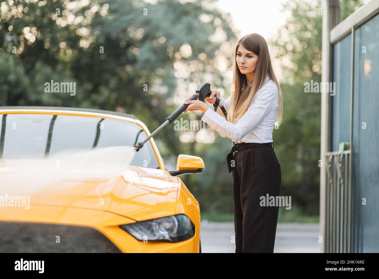 Car wash service outdoors. Caucasian confident stylish european ...