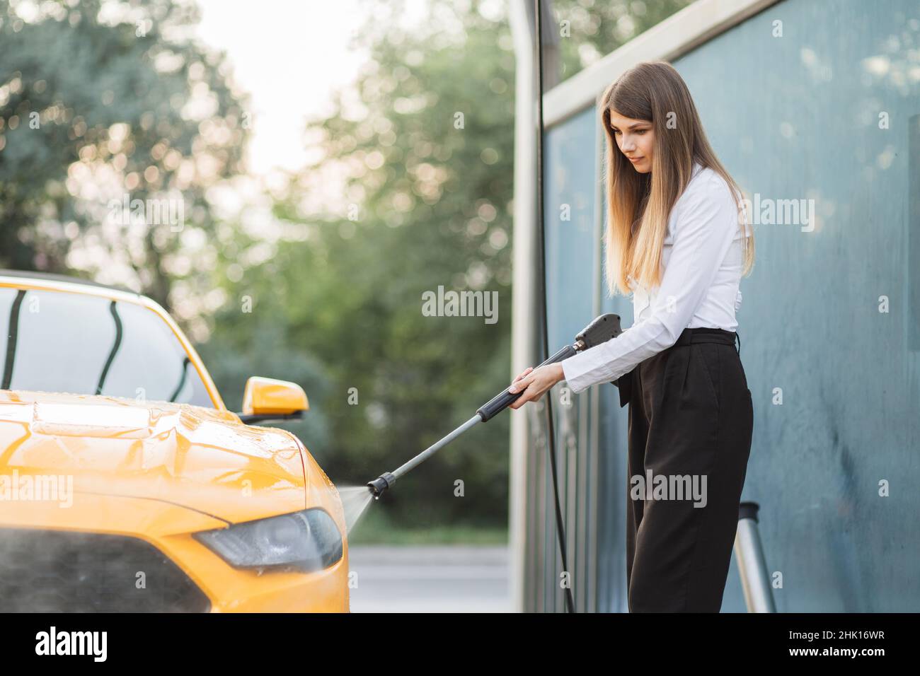 Car wash service outdoors. Caucasian confident stylish european ...