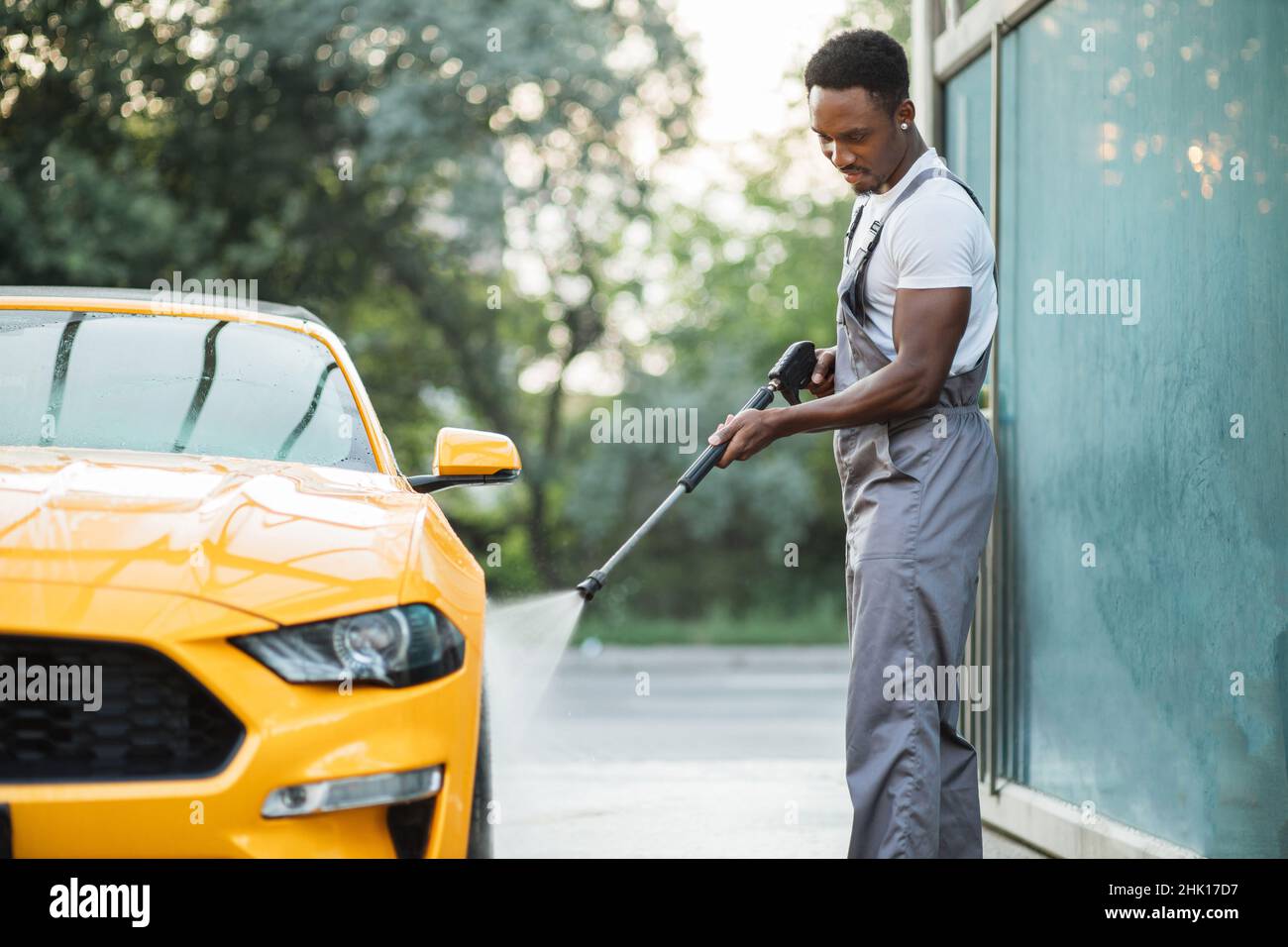 African man washing clothes in hi-res stock photography and images - Alamy