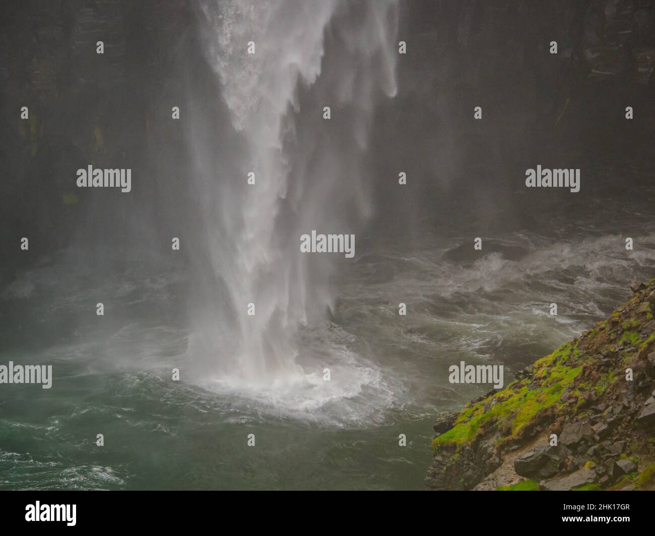 Close uo for waterfall Gasadalur falling into the ocean during strong ...