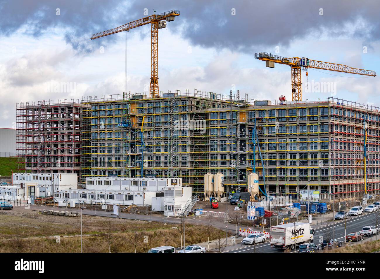 Large construction site, scaffolded shell of an office building complex ...