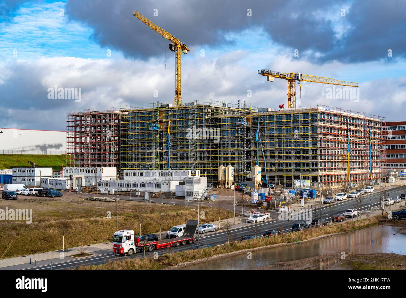 Large construction site, scaffolded shell of an office building complex ...