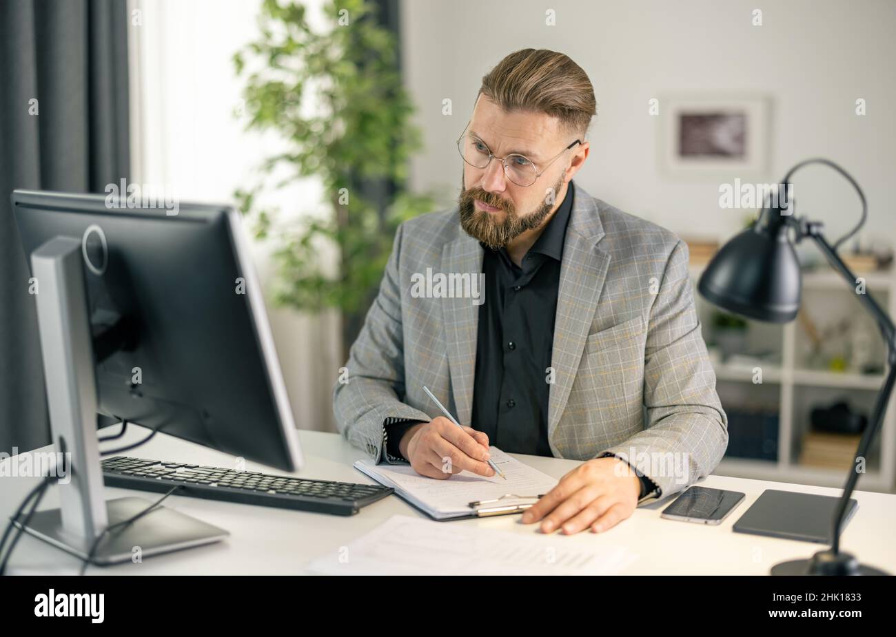 Man at office using pc Stock Photo - Alamy