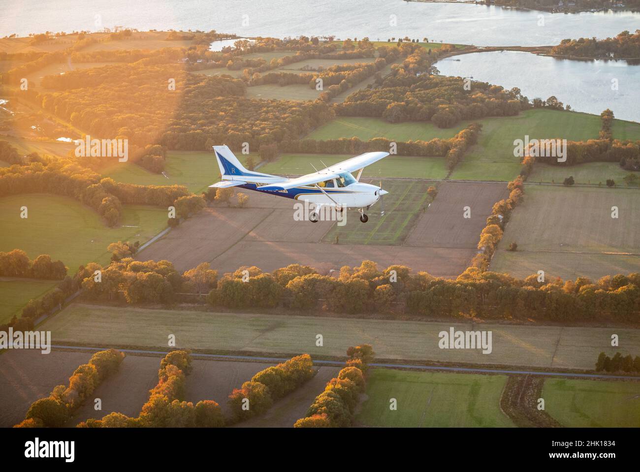 A cessna 172 taking a sunset flight over the Chesapeake Bay in Maryland ...
