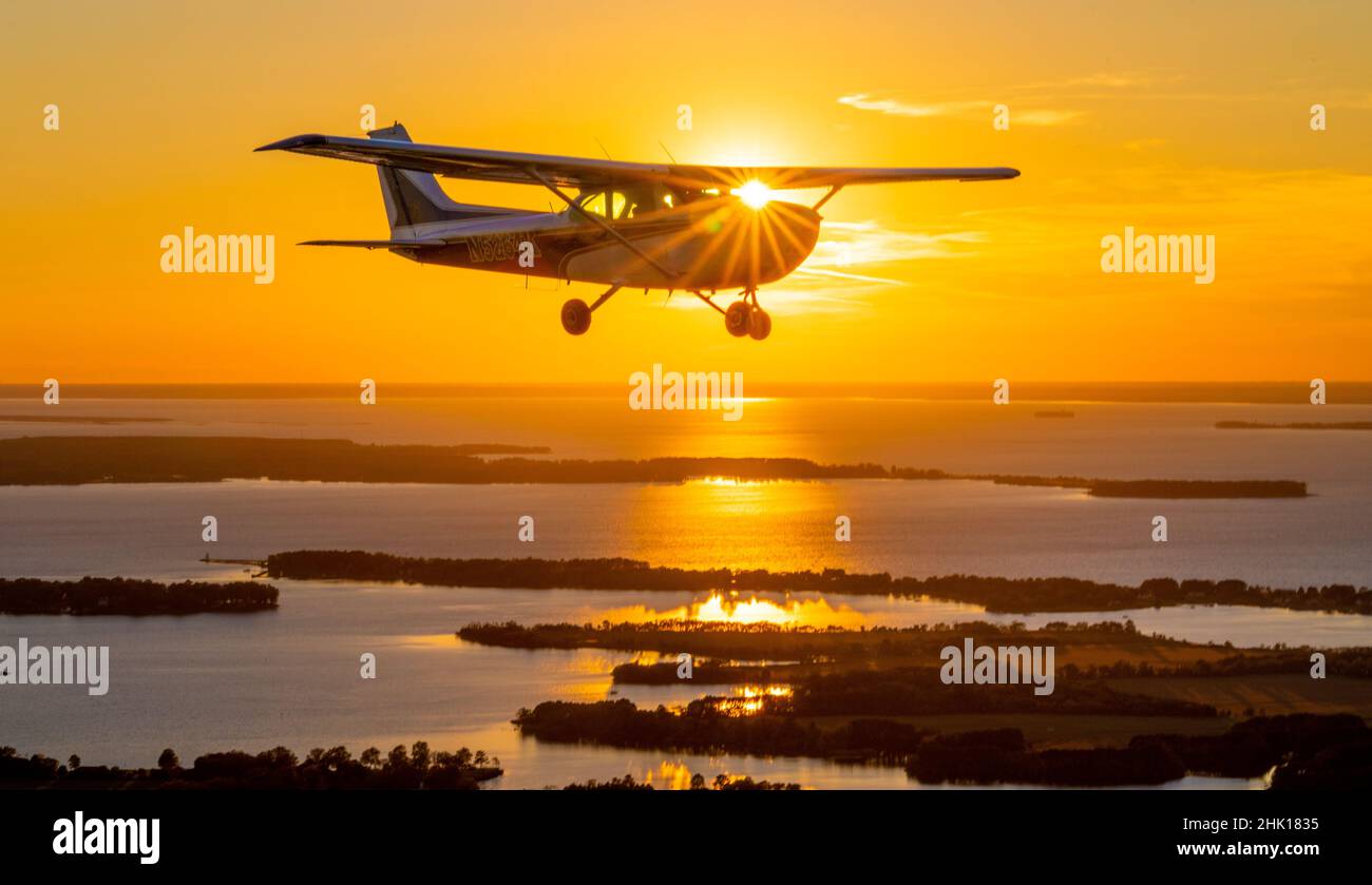 A cessna 172 taking a sunset flight over the Chesapeake Bay in Maryland ...