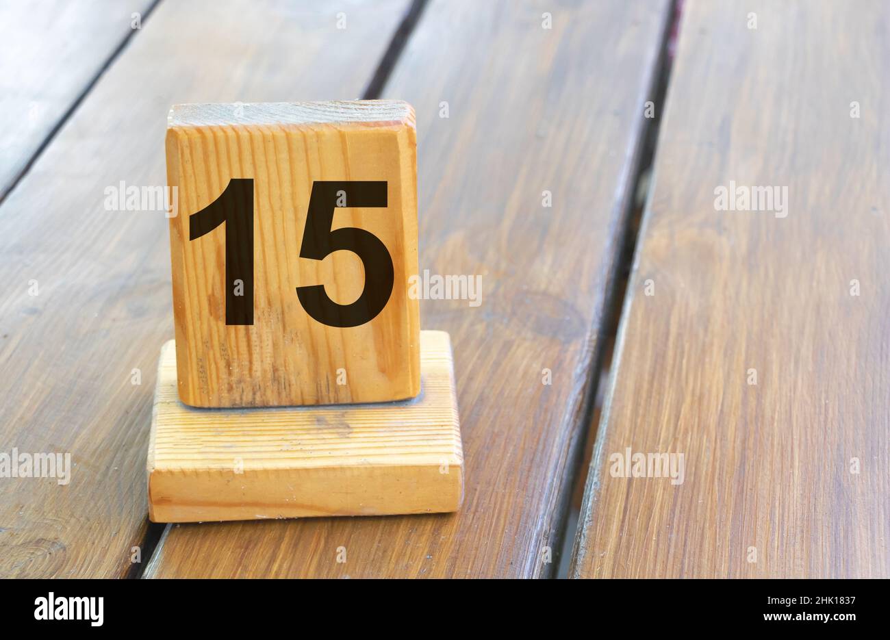 Wooden priority number 15 on a plank tab Stock Photo - Alamy