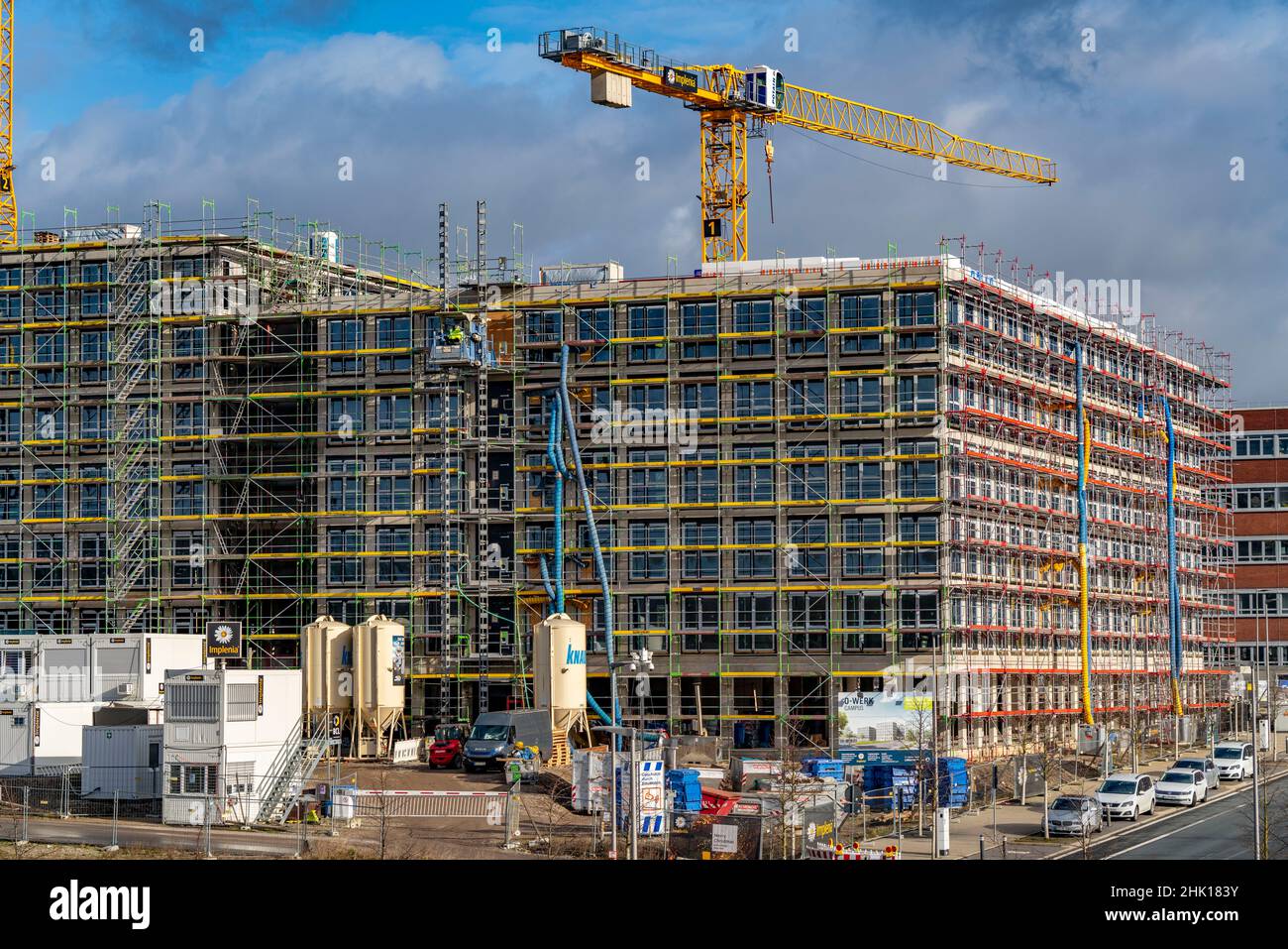 Large construction site, scaffolded shell of an office building complex ...