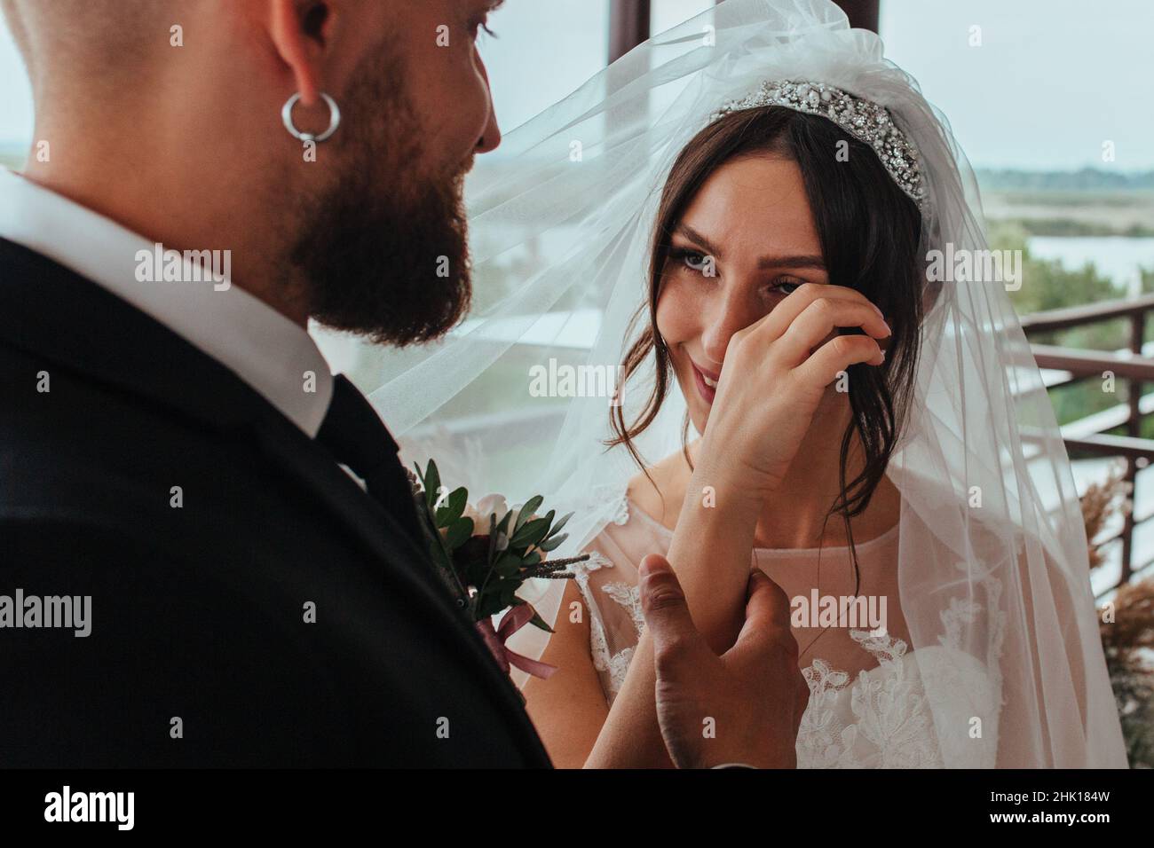 Wedding. Close-up of the bride who cries with happiness at the wedding ...