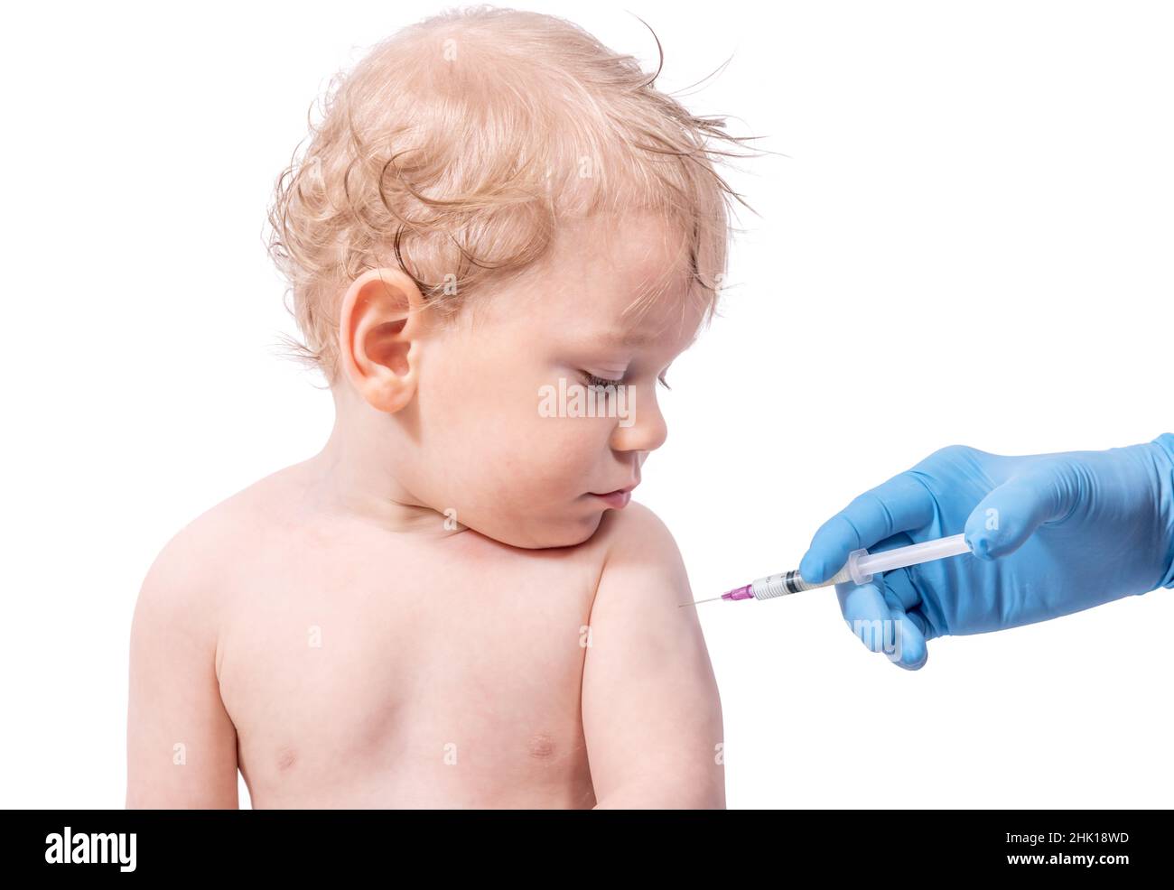 A small child got an injection in the his shoulder. Vaccination of a ...
