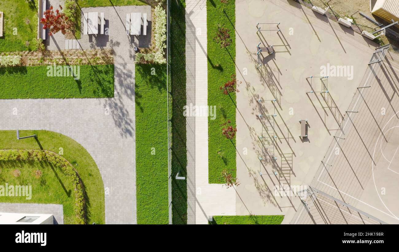 Top view of sports field near residential building. Action. Refined ...