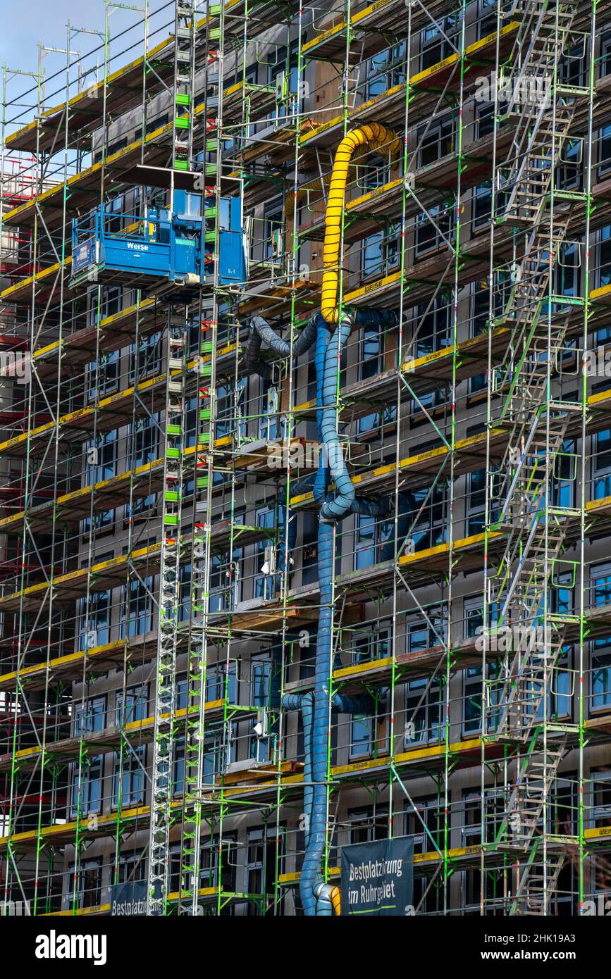 Large construction site, scaffolded shell of an office building complex ...