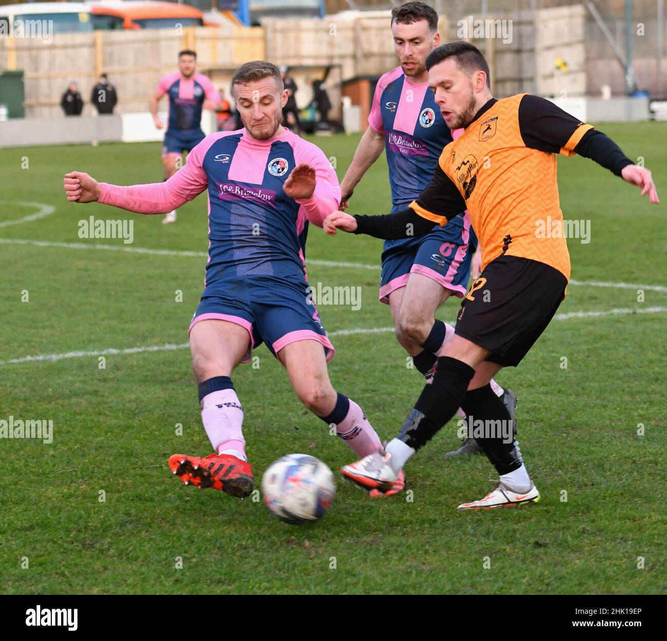 Football action in the match between New Mills and West Didsbury and ...