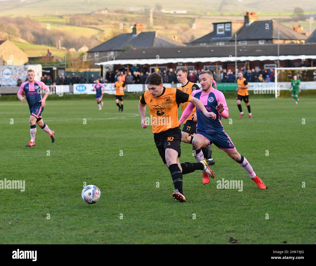 Football action in the match between New Mills and West Didsbury and ...