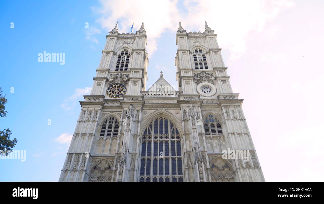 Facade of Gothic white building with towers on background of sky ...