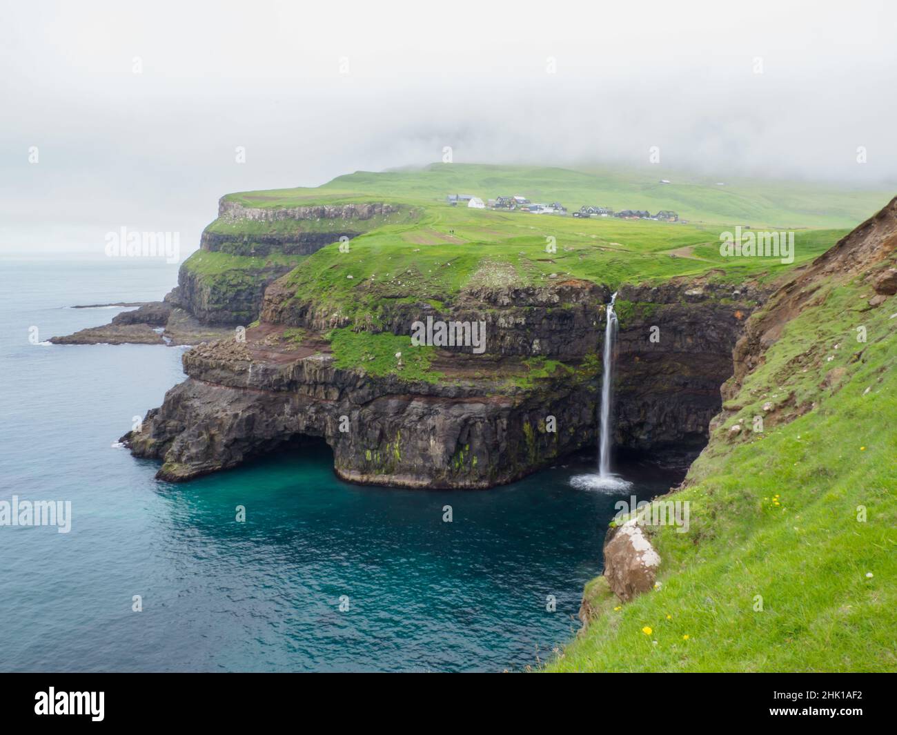Waterfall Gasadalur falling into the ocean, Vagar Island, Faroe Islands ...