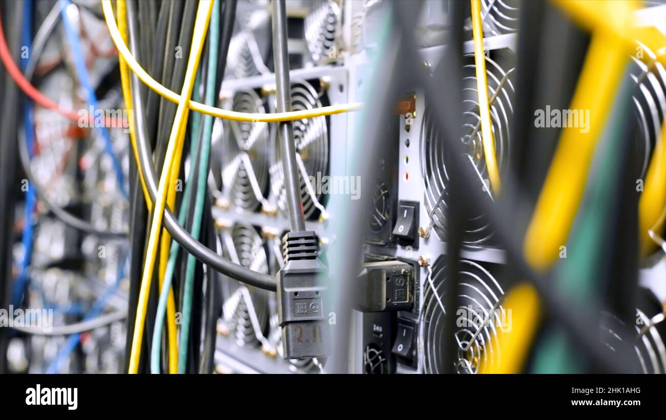 Wall of data centers and wires. Stock footage. Lots of units with data ...