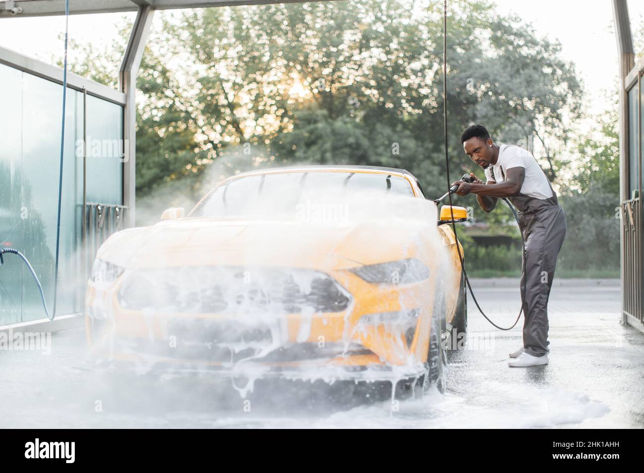 Young man focused on cleaning hi-res stock photography and images - Alamy