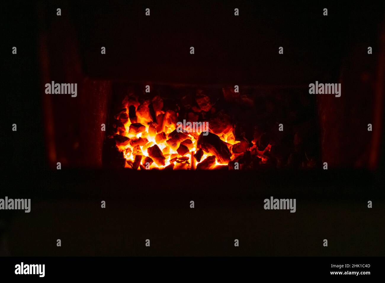 Burning coals in a solid fuel boiler. Heating of a residential building ...