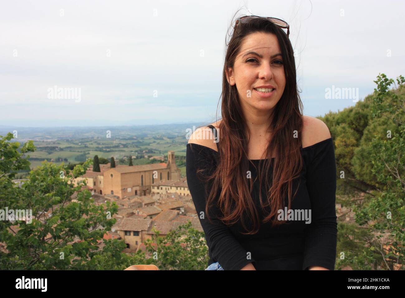 charming brunette caucasian girl and the background of medieval and ...