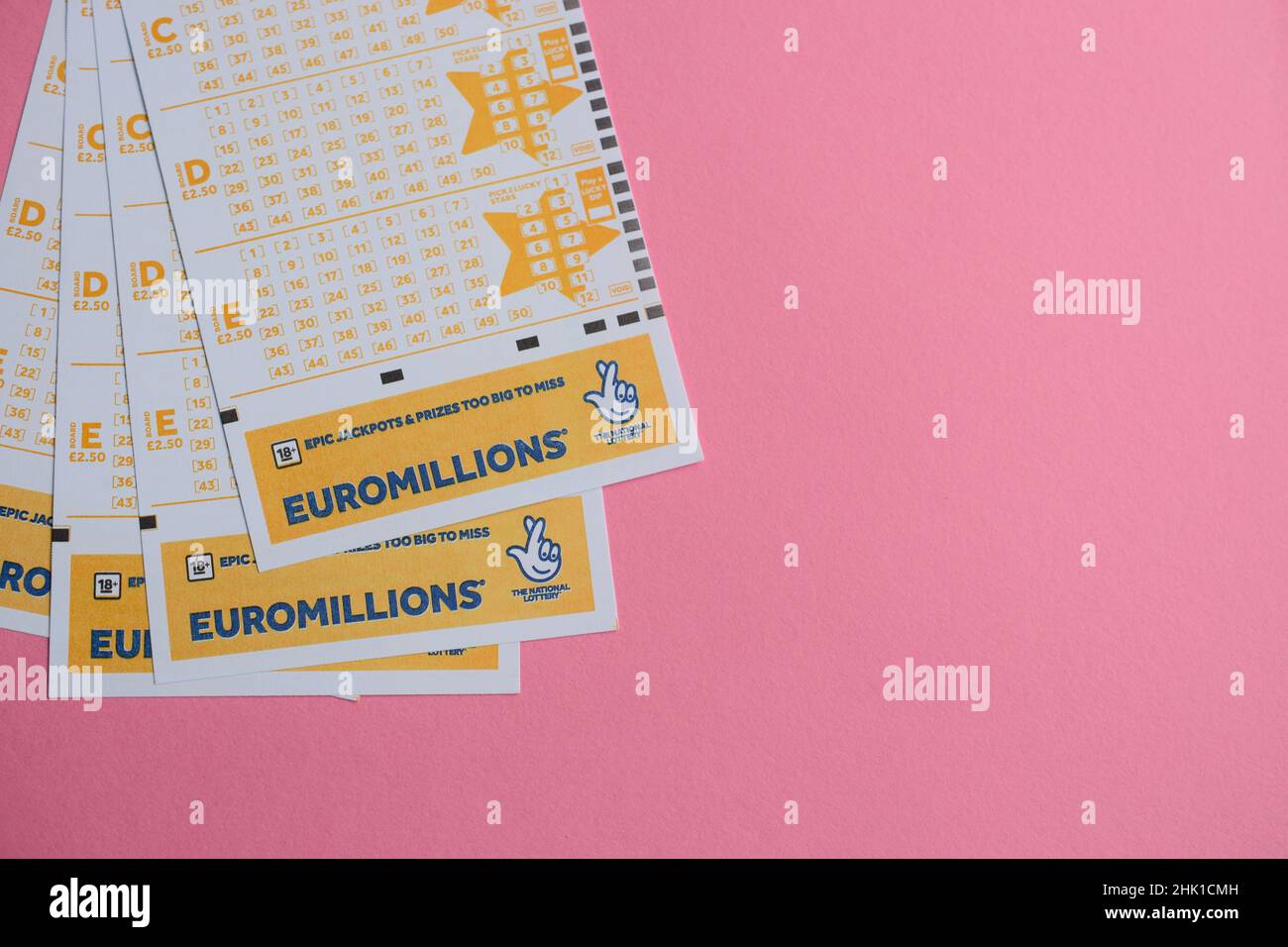 Euromillion lottery slips on pink background Stock Photo - Alamy