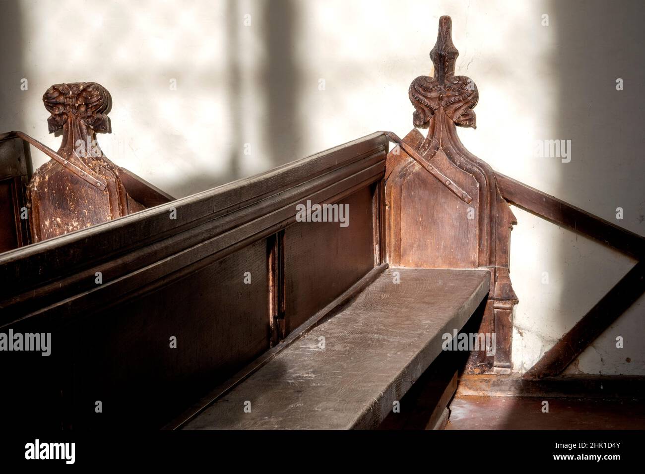 Carved timber bench end with repaired woodwork at The Church of St ...
