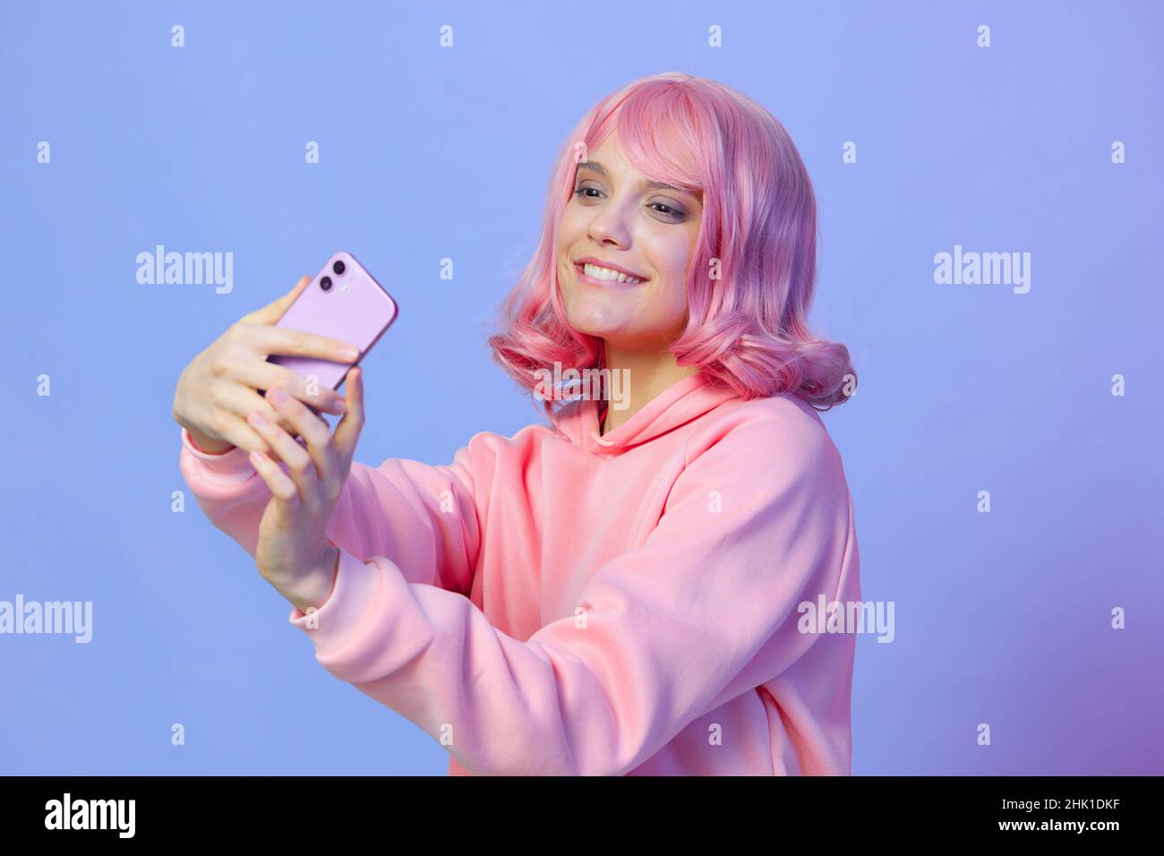 beautiful woman holding a phone posing technology isolated background ...