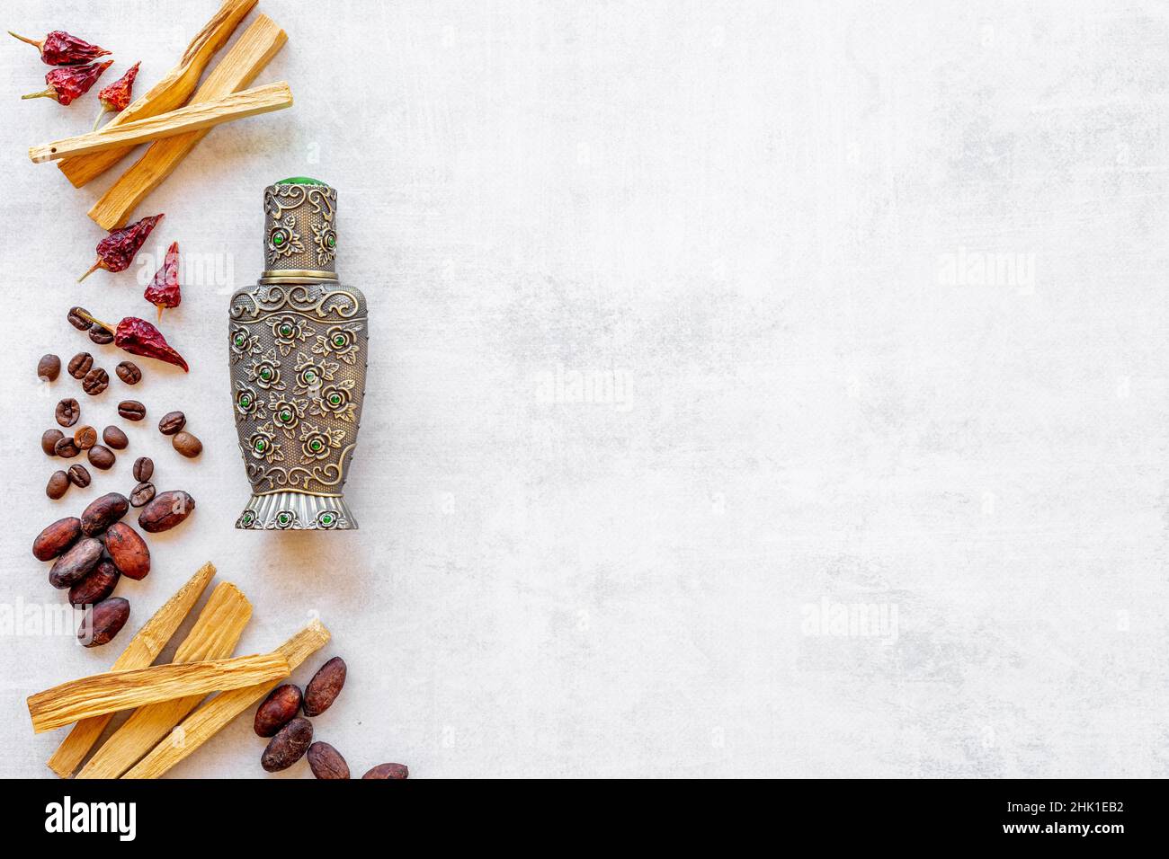 Silver bottle of arabian oud perfume with ingredients Stock Photo - Alamy