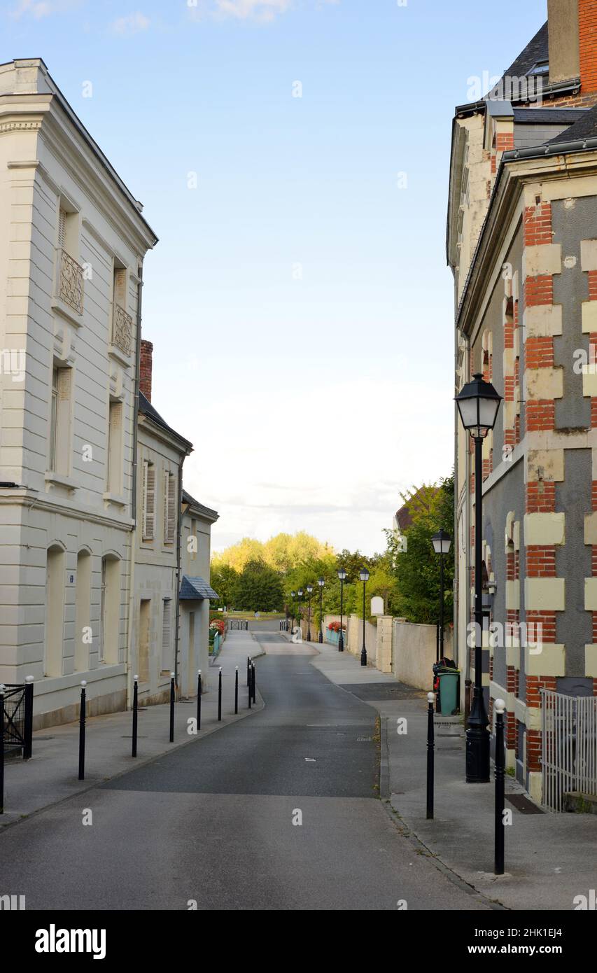 Small town street with no cars and traditional french architecture ...