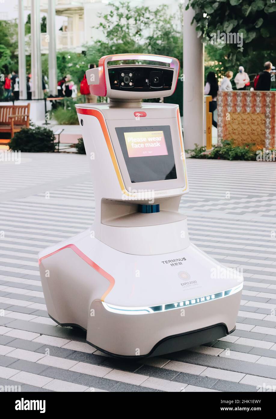 Dubai, UAE - 01.05.2022: Moving cute white robot reminder to wear face ...