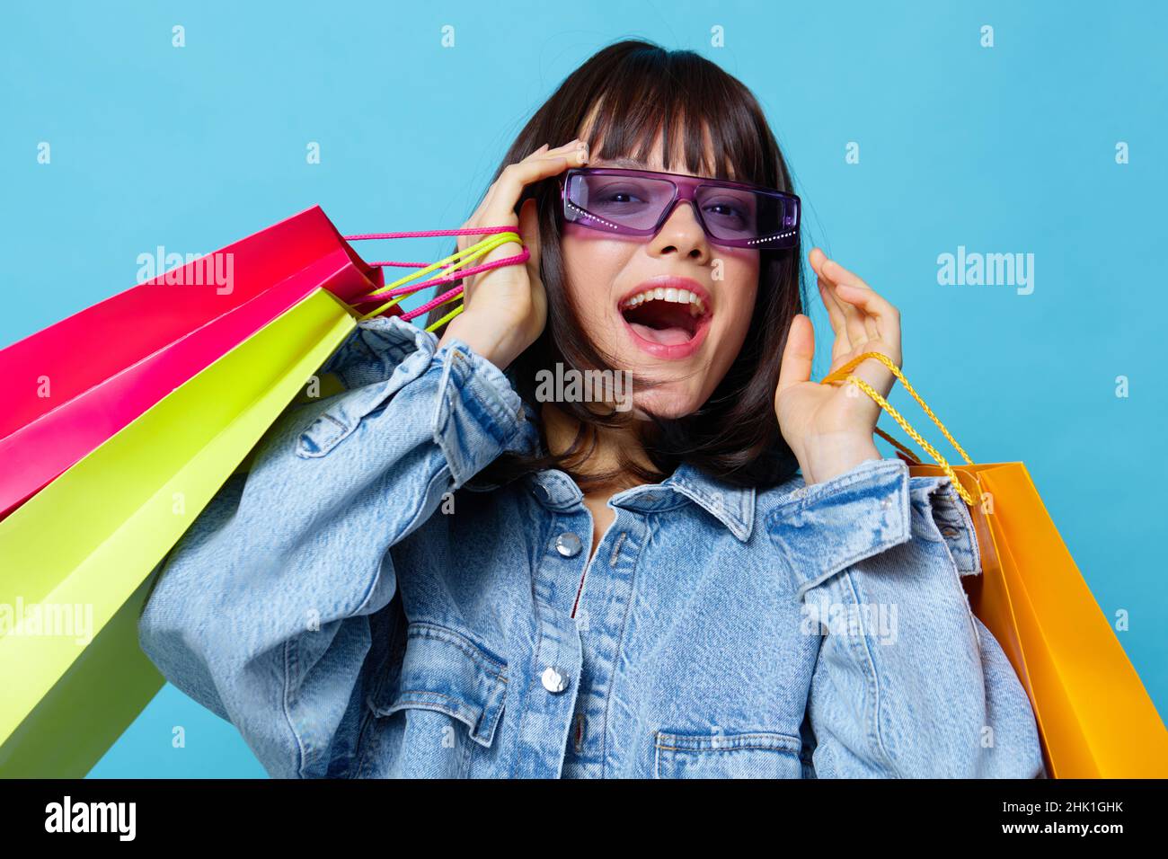 portrait woman in sunglasses shopping emotions posing joy blue ...