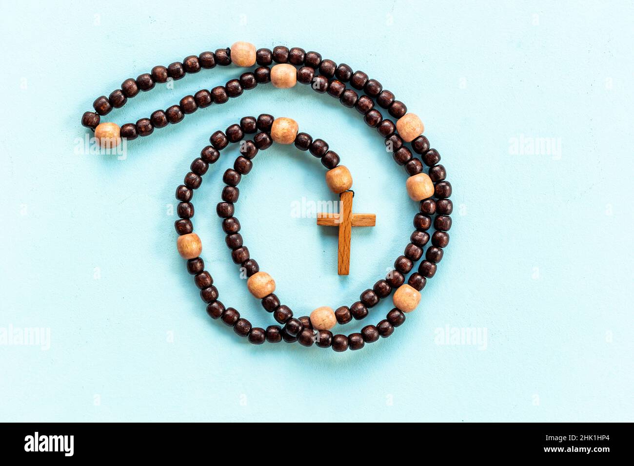 Wooden rosary beads with cross, top view. Christian concept Stock Photo ...