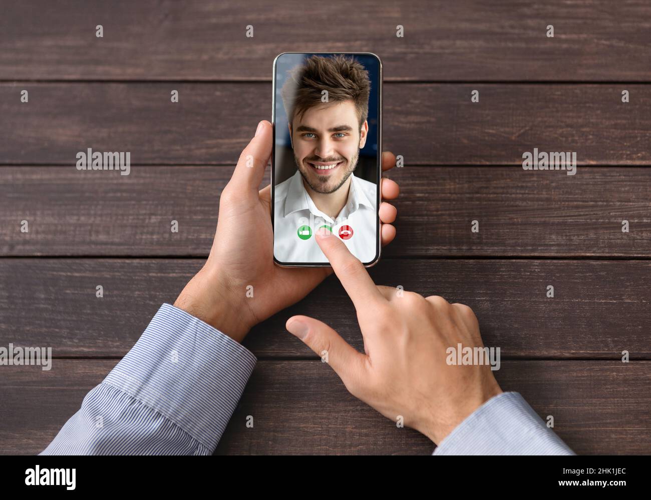 Distance communication. Man with smartphone making video call to his ...