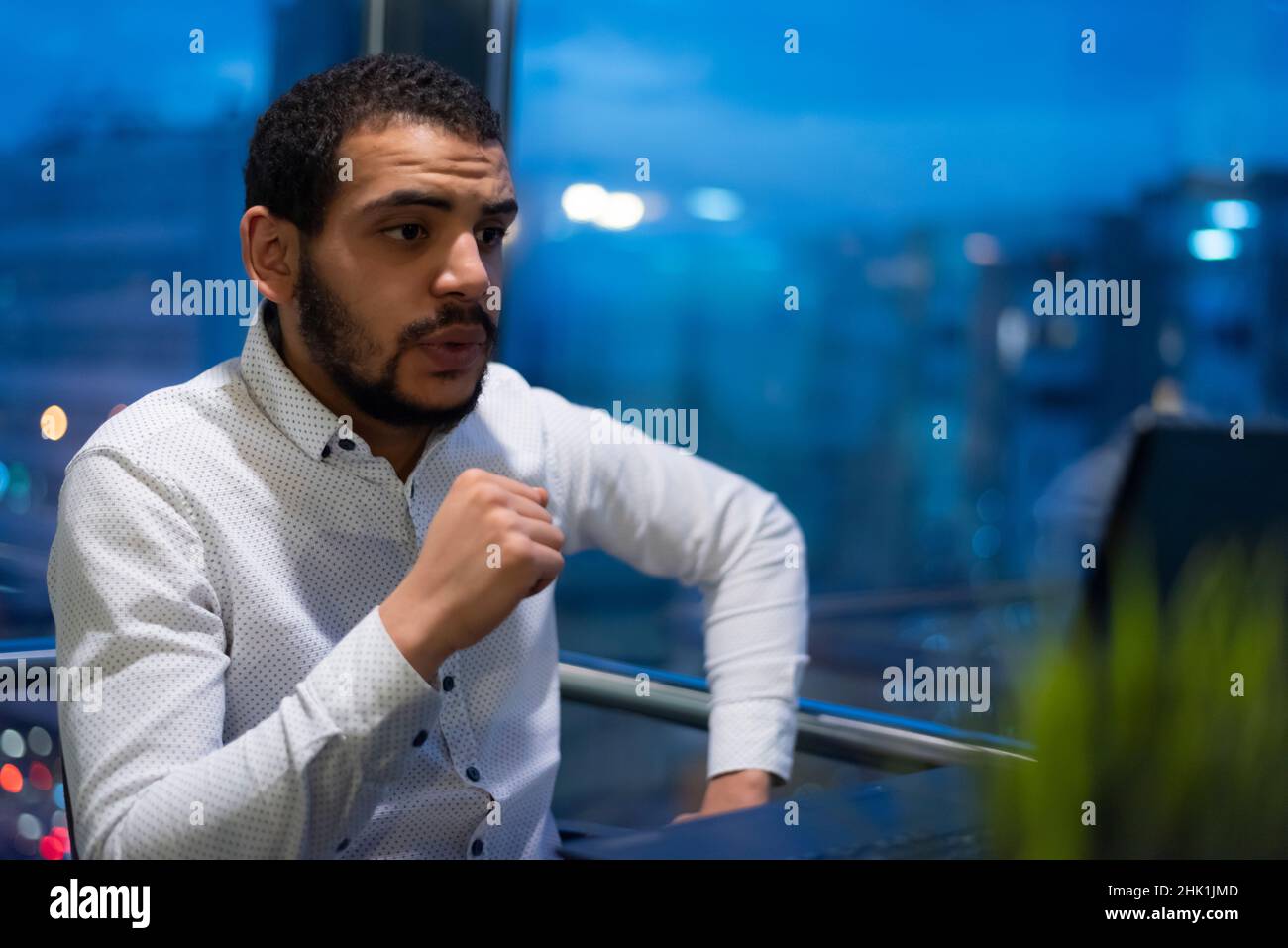 Virtual meeting with many people together. African-American young guy ...