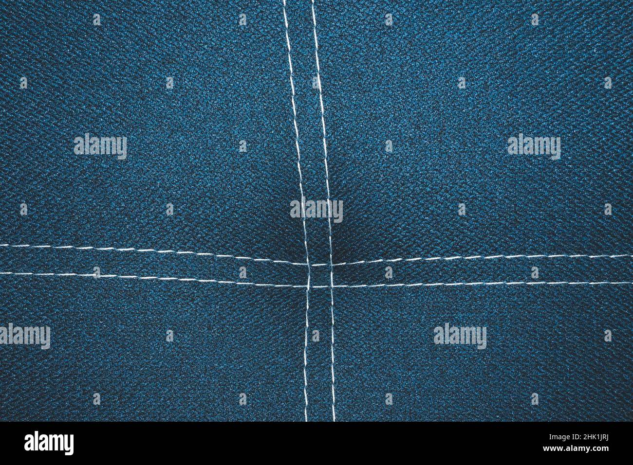 Dark blue denim background with white stitching close up background ...