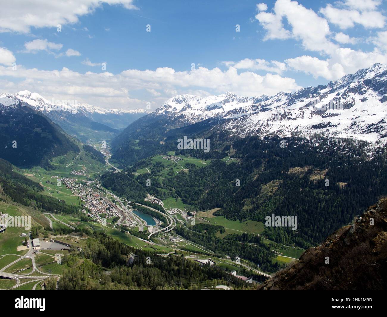 Mountainous landscape in Switzerland with snowy peak and village in the ...