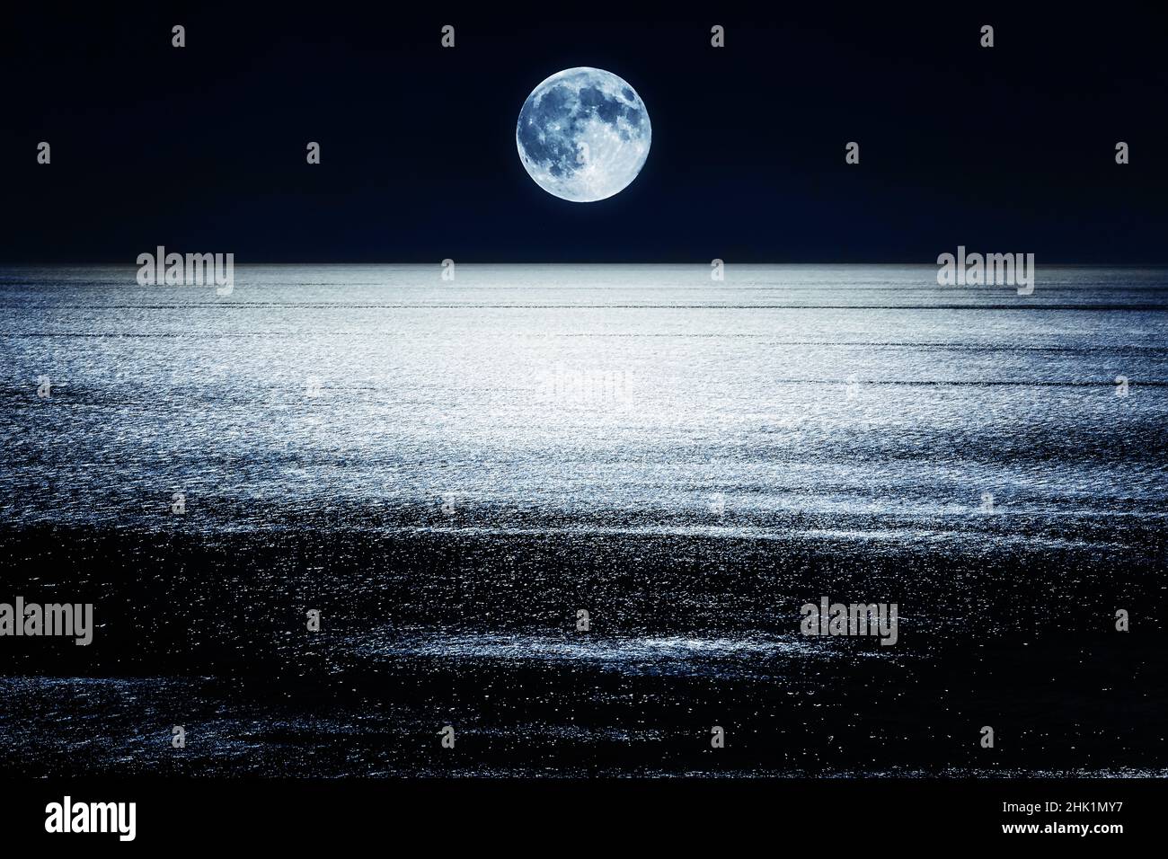 Full Moon setting over the Mediterranean Sea Stock Photo - Alamy