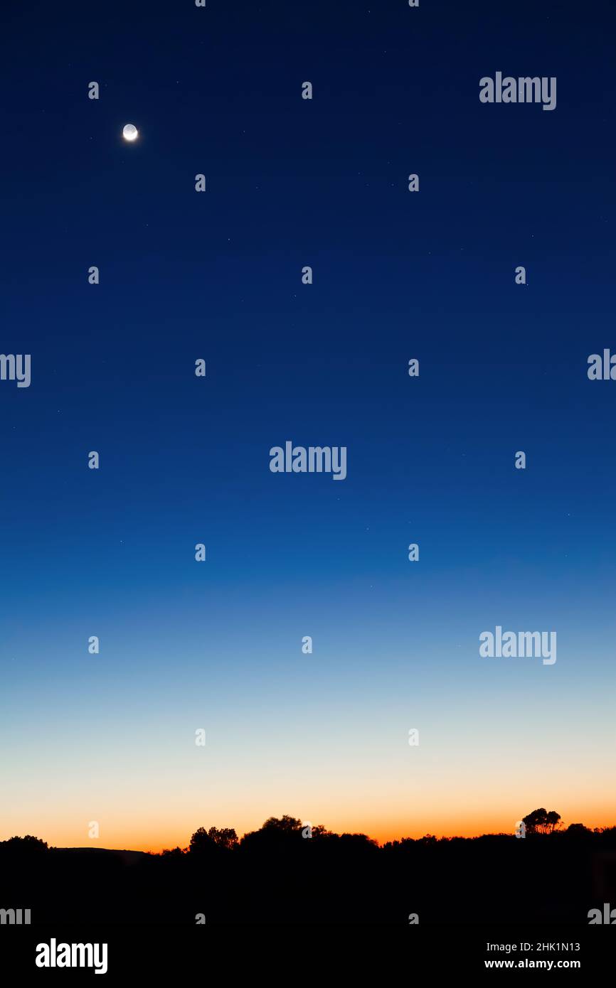 Crescent Moon late at dusk Stock Photo - Alamy