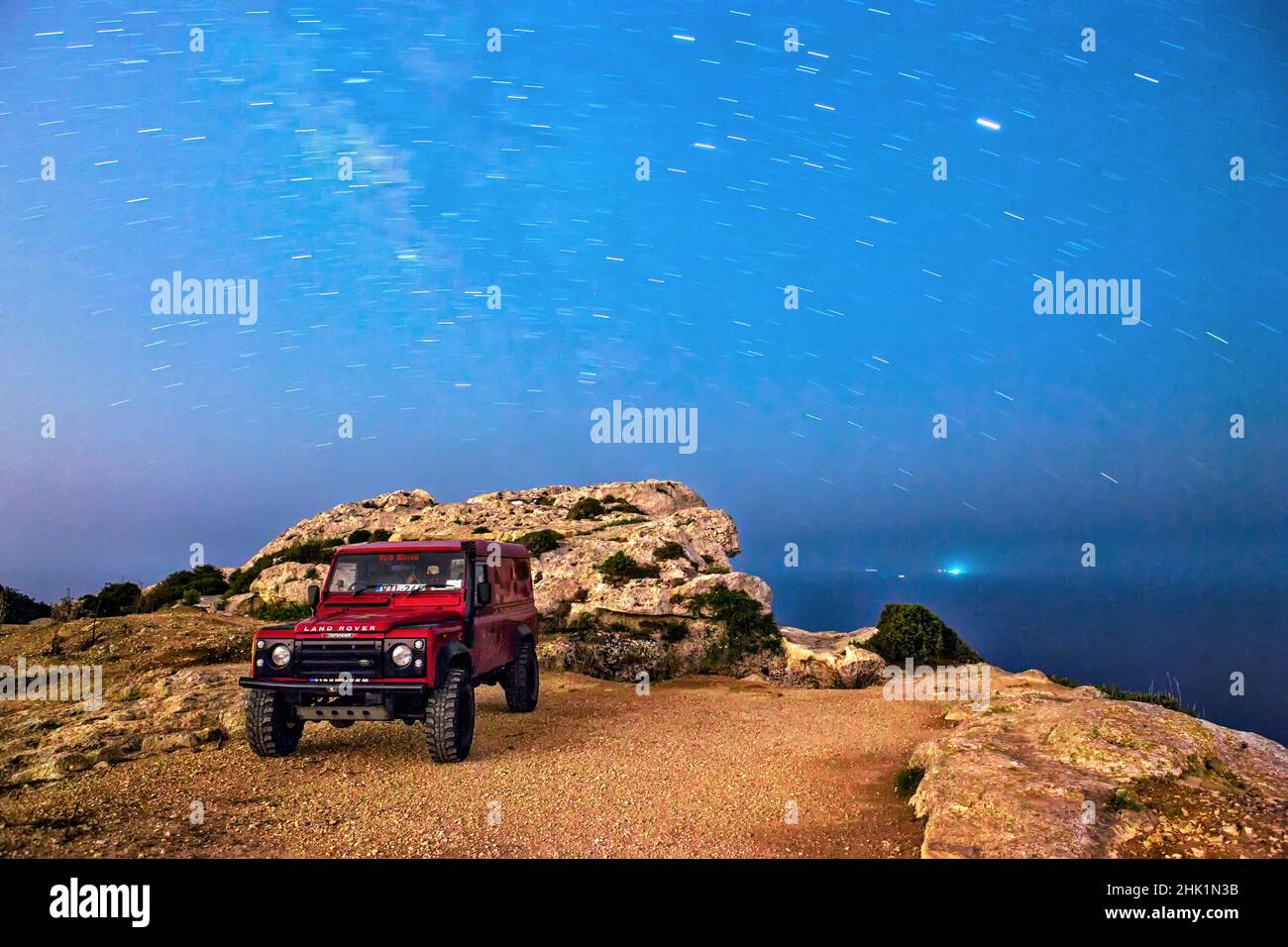 Land Rover Defender 110 under Star Trails Stock Photo - Alamy