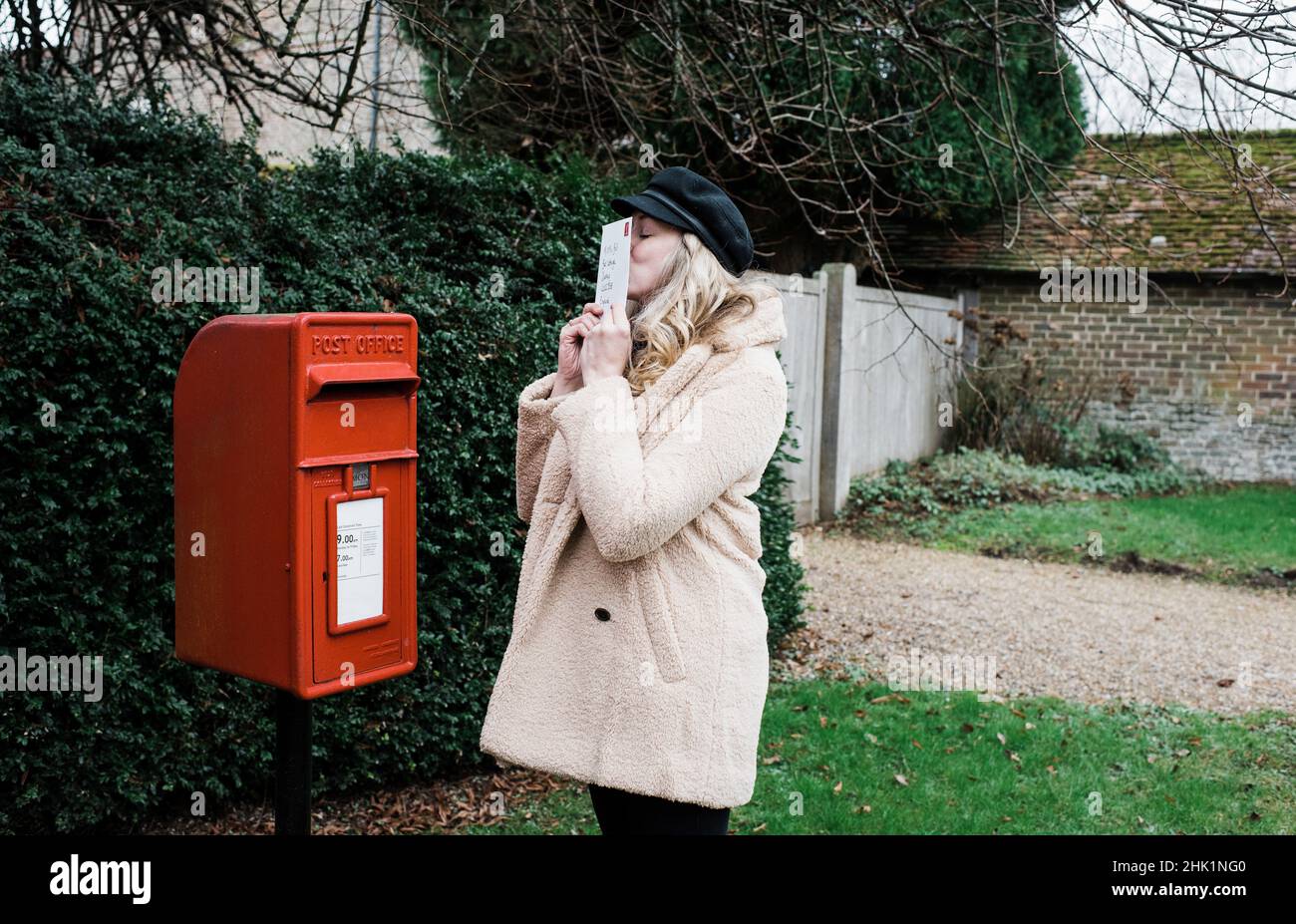 Woman posting letter in post hi-res stock photography and images - Alamy