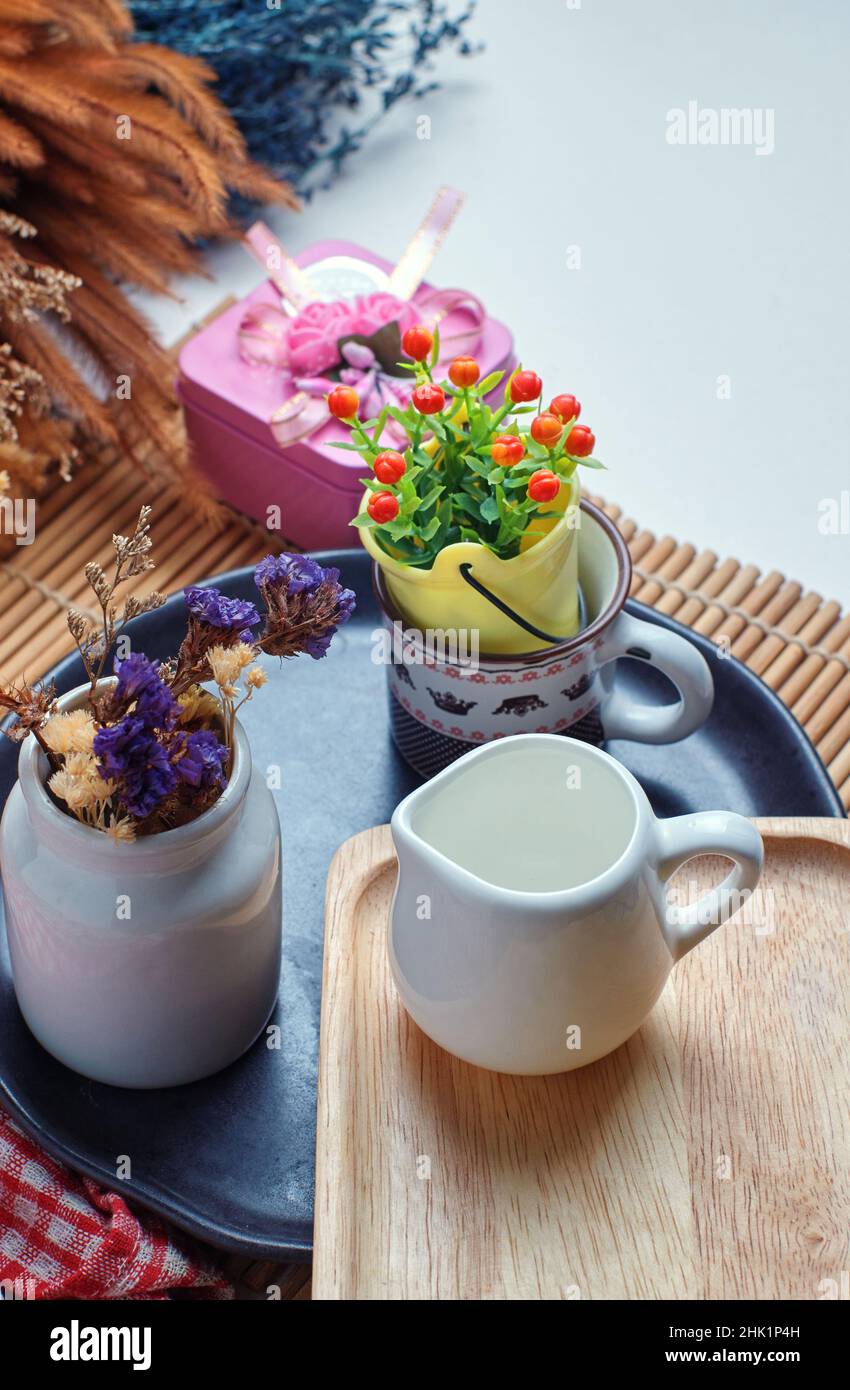 The small white color ceramic wears on the table Stock Photo - Alamy