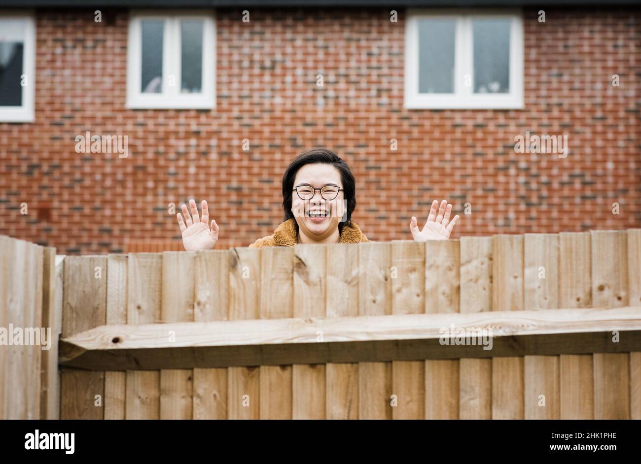Lady waving at neighbor hi-res stock photography and images - Alamy