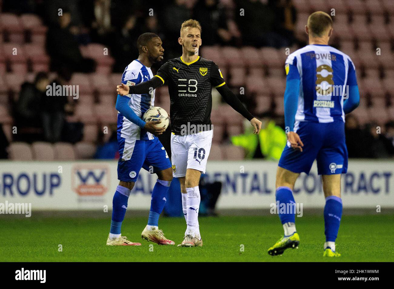 Mark Sykes #10 of Oxford United complaining to Referee Andrew Kitchen ...
