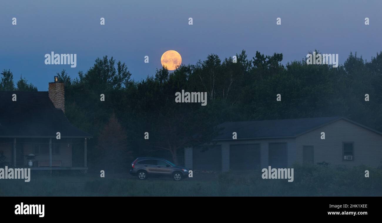 The full moon setting over a homestead in northern Wisconsin Stock ...