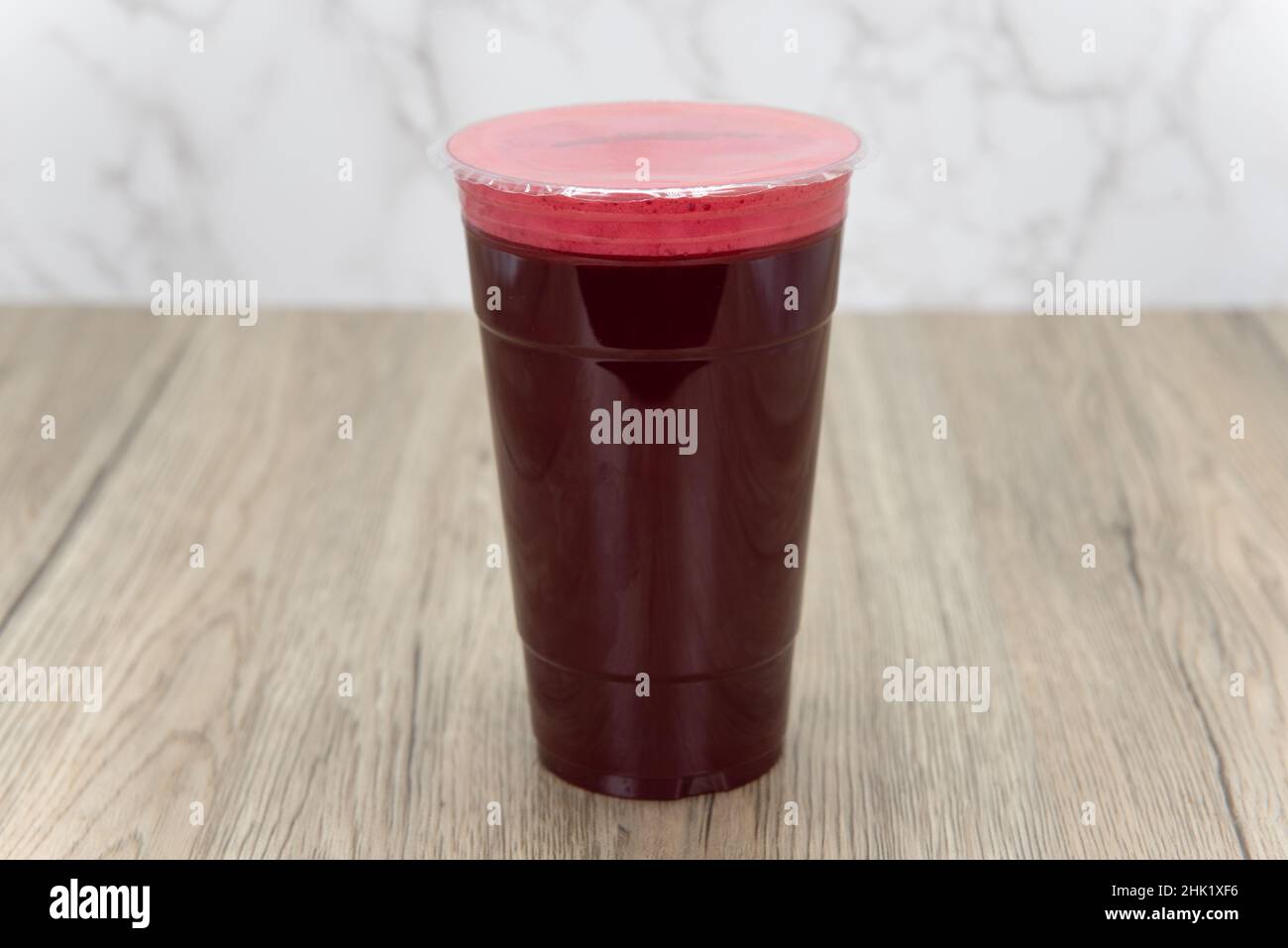 Blended fruit and vegetable smoothie makes a deep blood red color full ...
